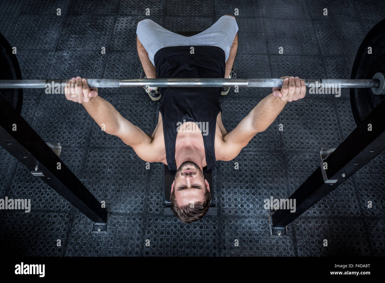 Fit man lifting heavy barbell Stock Photo - Alamy