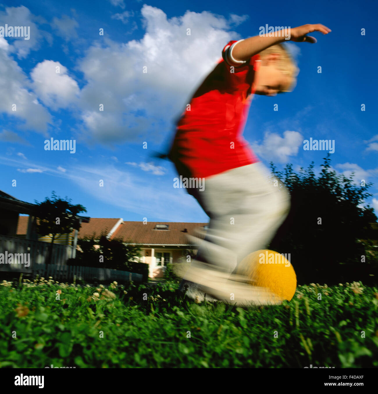 Boy playing with ball Stock Photo - Alamy