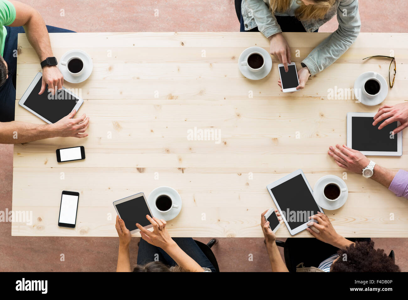 Overhead of students working together Stock Photo - Alamy