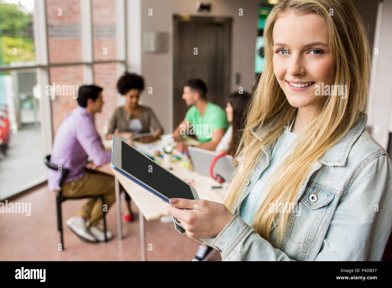 Student working on assignment with tablet Stock Photo - Alamy