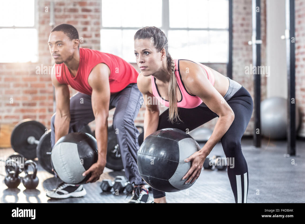 Fit couple doing ball exercise Stock Photo - Alamy