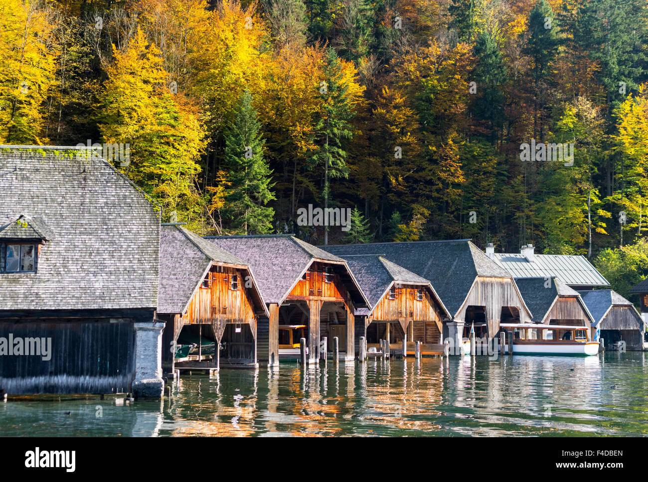 The jetty of schoenau village with traditional wooden boathouses for ...