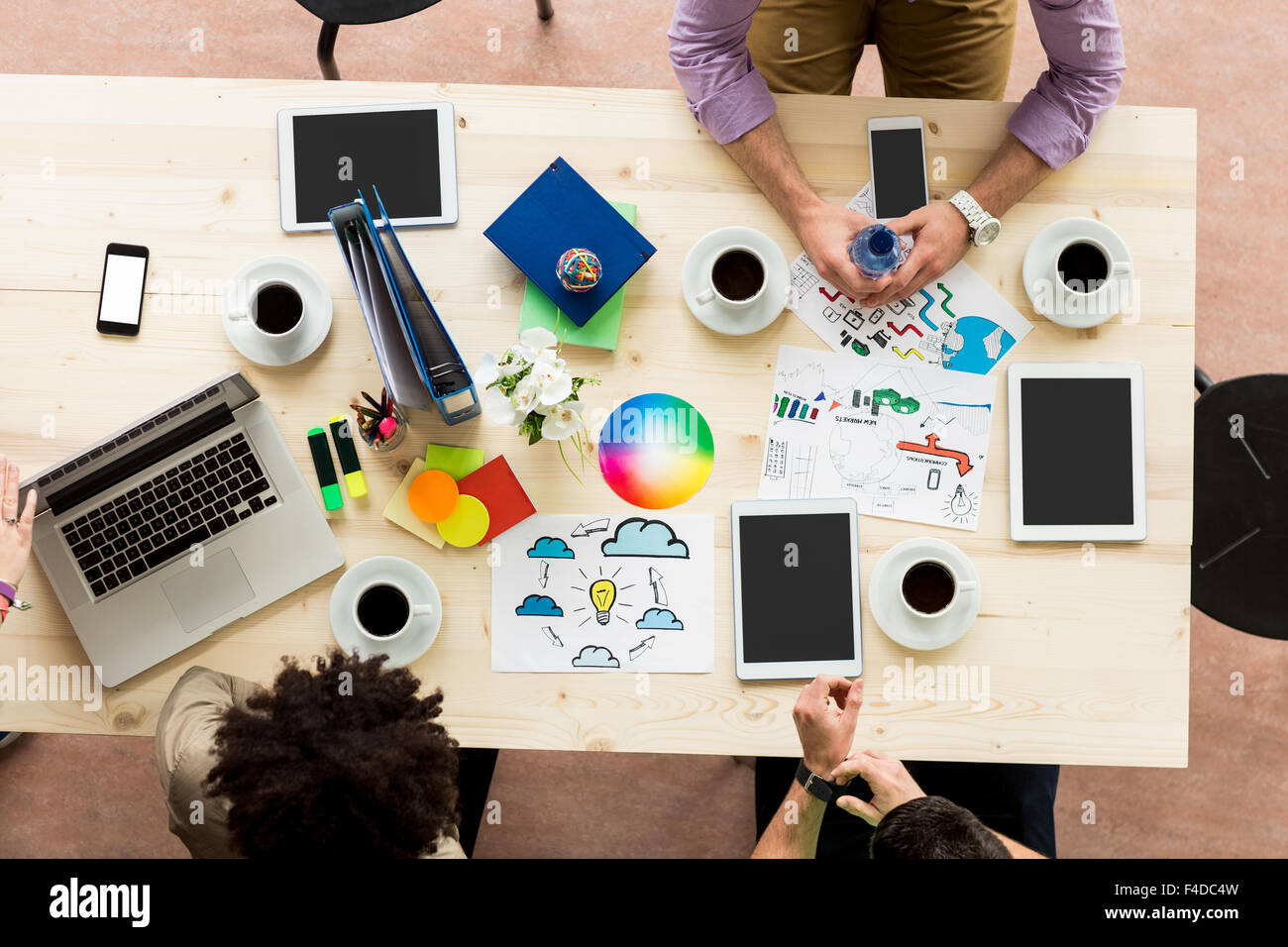 Overhead of students working together Stock Photo - Alamy
