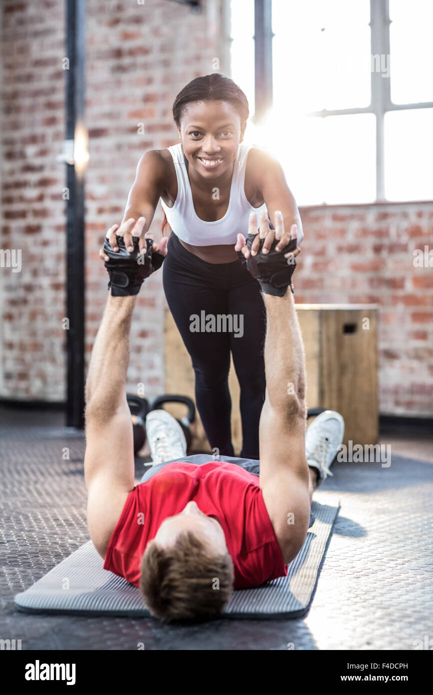 Muscular couple doing core exercises Stock Photo - Alamy