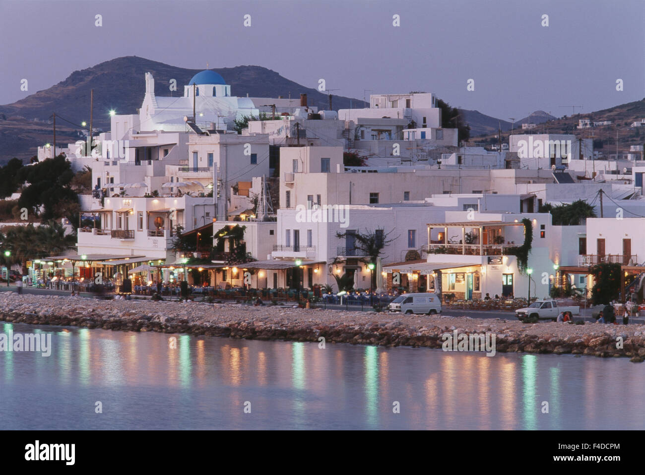 Greece, Cyclades Islands, Paros, Evening view of town and harbor ...