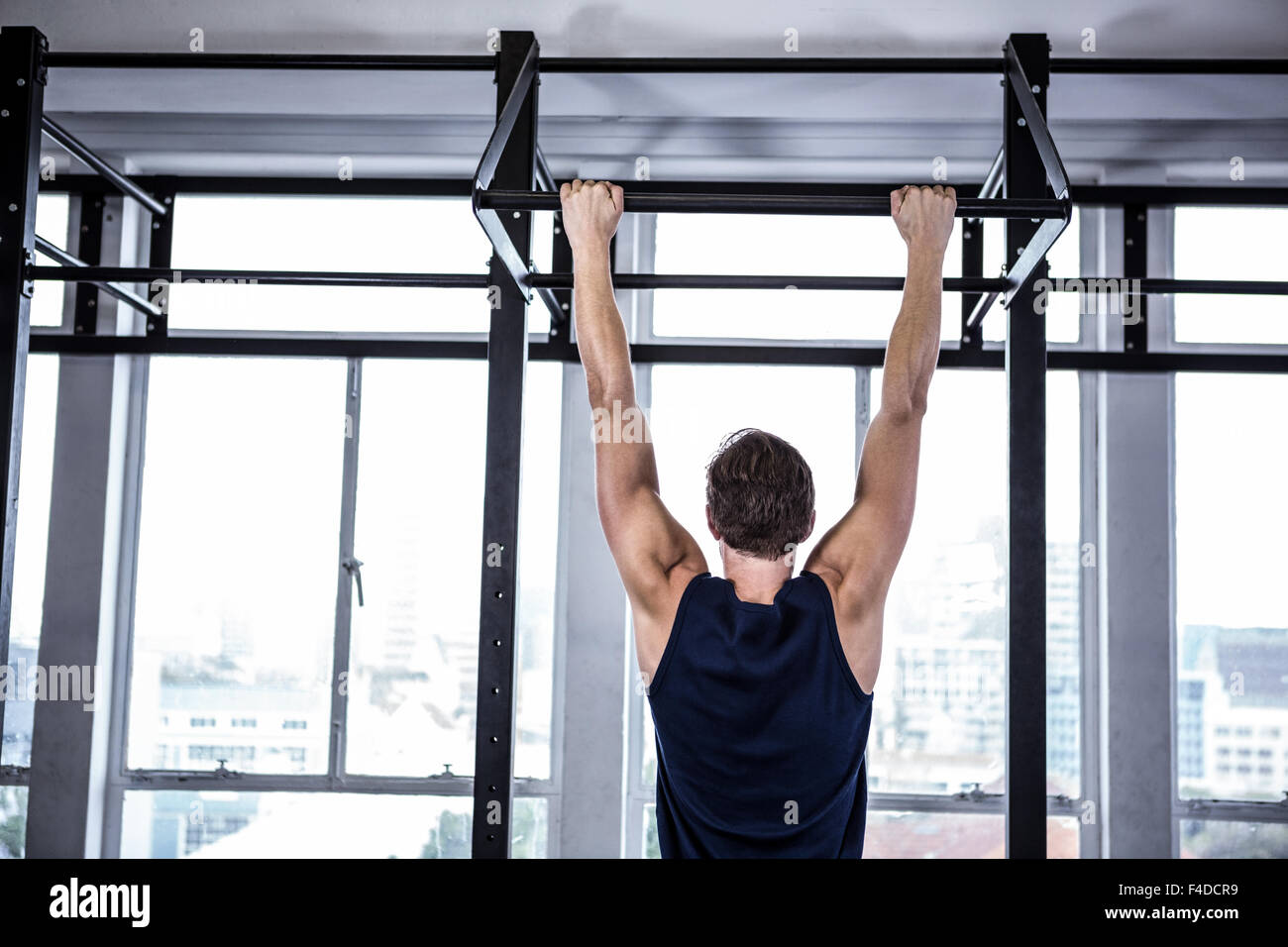 Fit man doing pull ups Stock Photo - Alamy