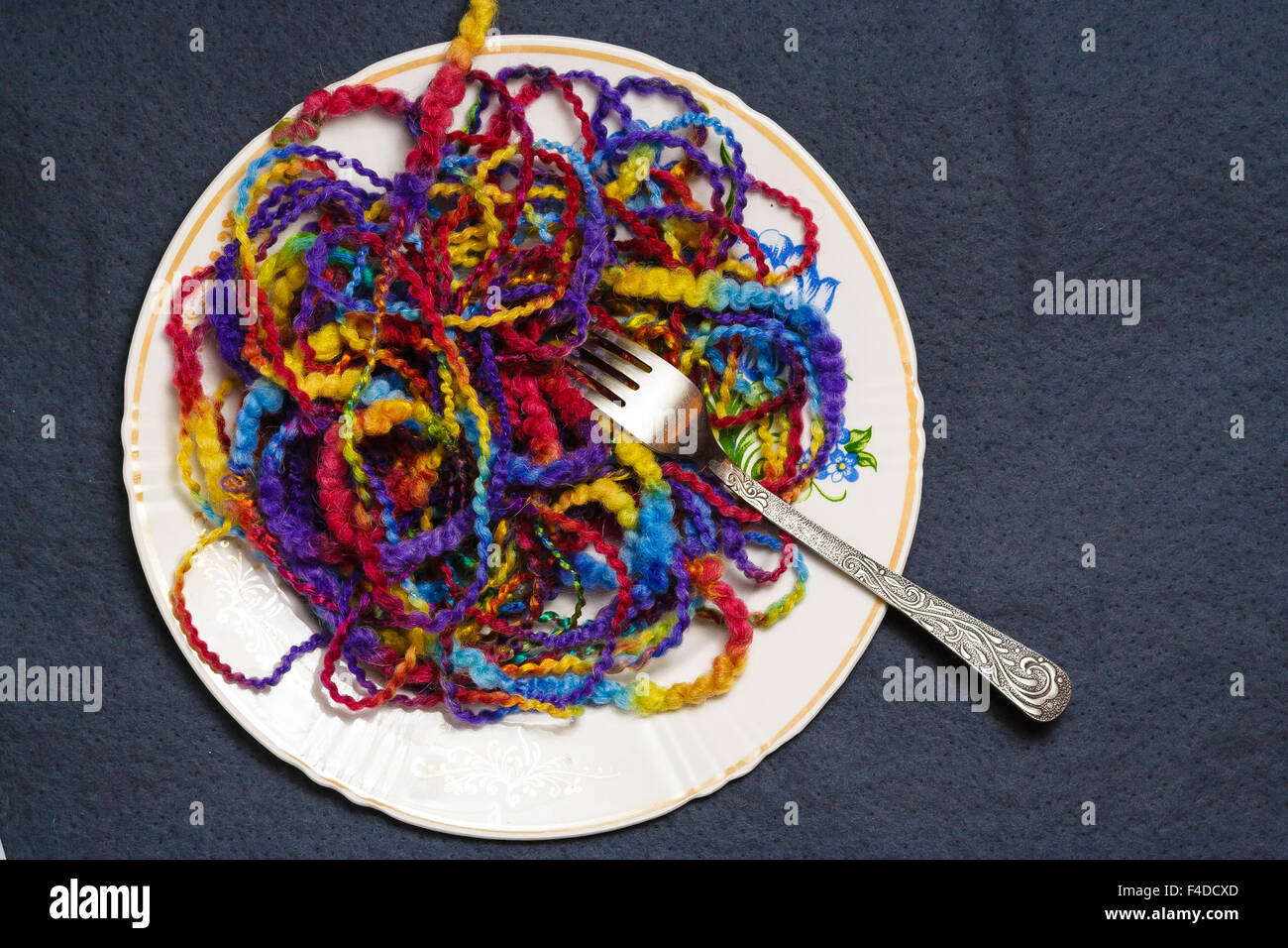 Full plate of melange yarn on wool texture background Stock Photo - Alamy