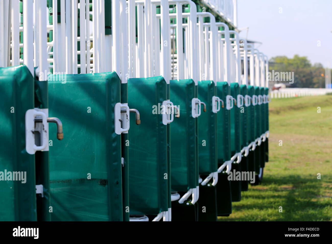 Horse track and starting gates as a background Stock Photo - Alamy