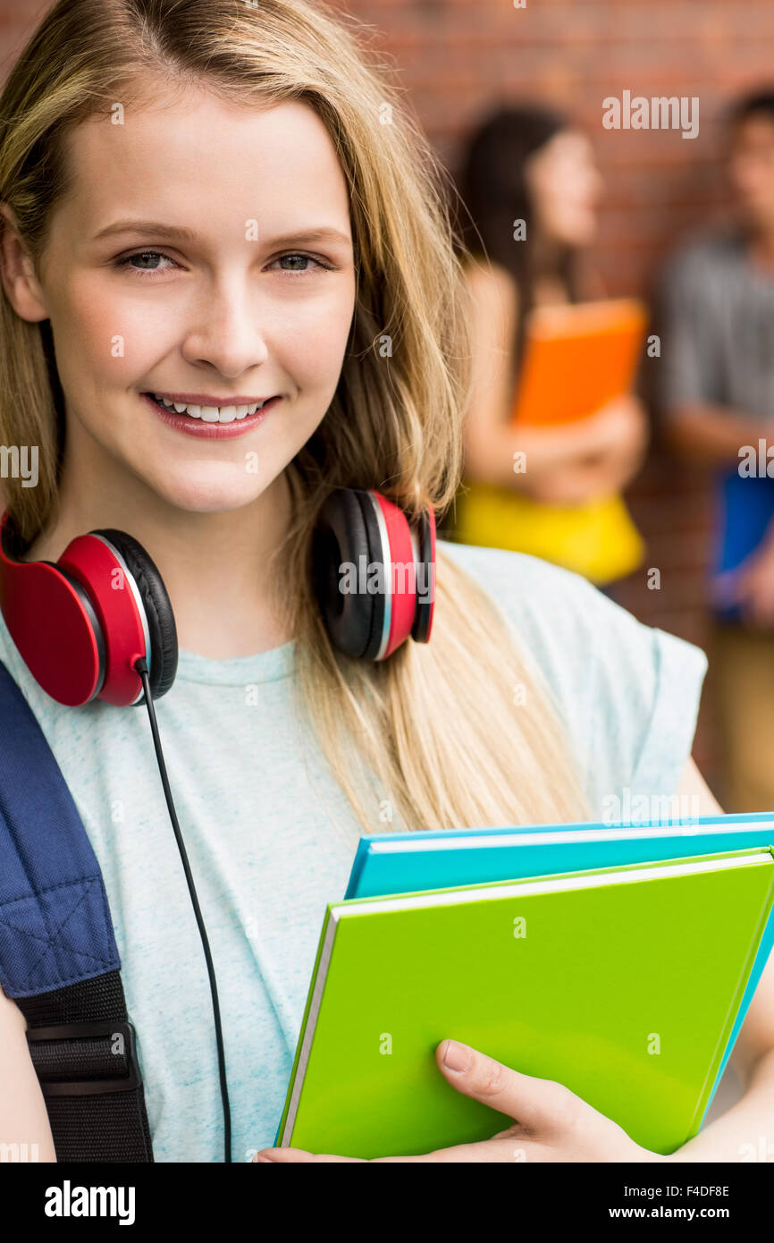 Student smiling at camera outside Stock Photo - Alamy
