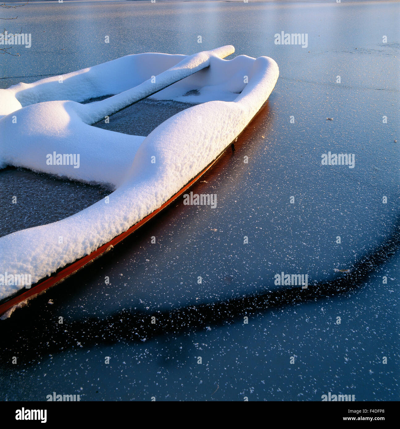 A rowing boat covered in snow Stock Photo - Alamy