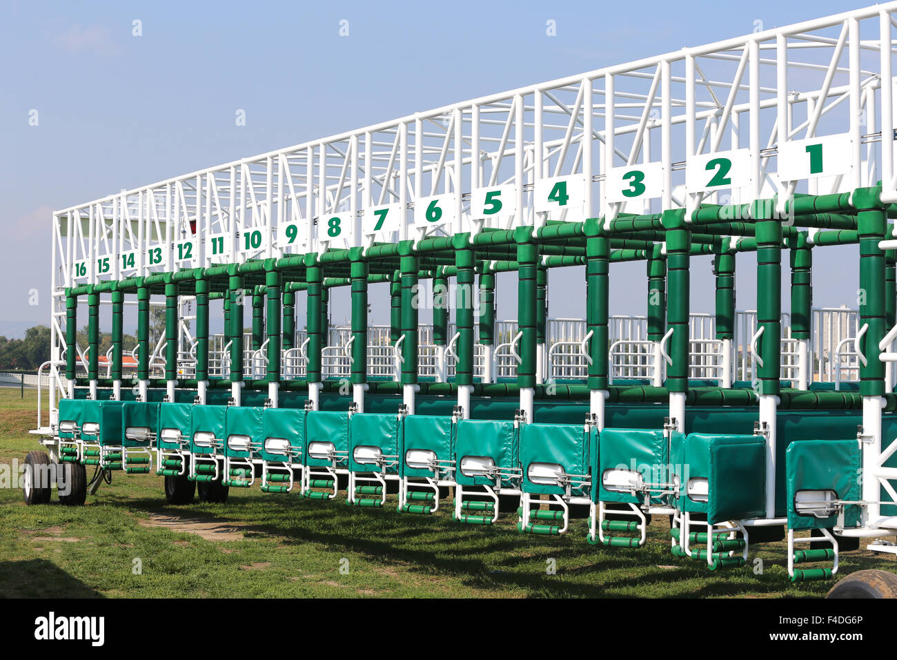 Horse track with starting gates as a background Stock Photo - Alamy