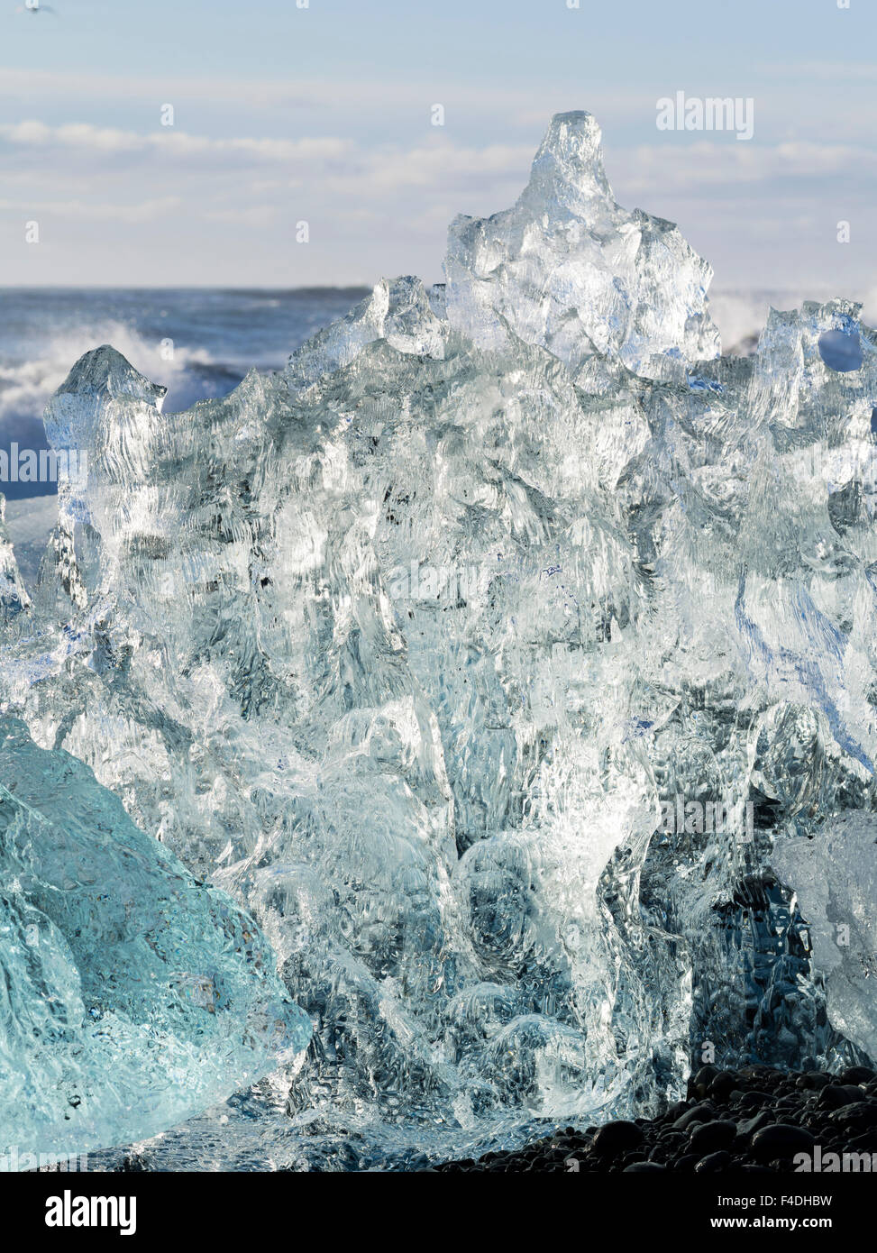 Iceberg on black volcanic beach. North Atlantic beach of the ice lagoon ...