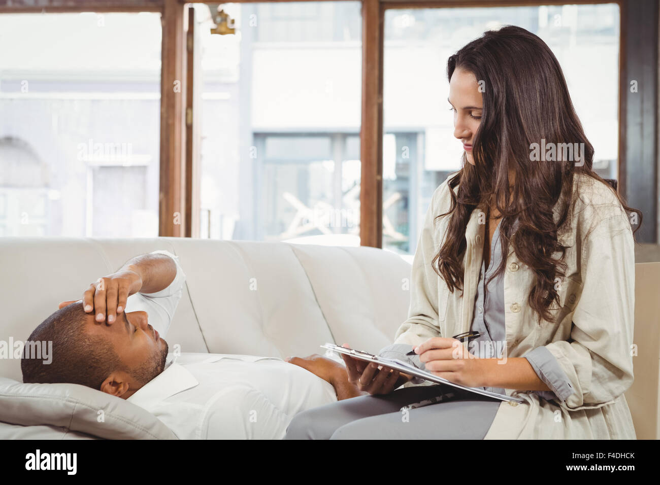 Counselor interacting with patient Stock Photo - Alamy