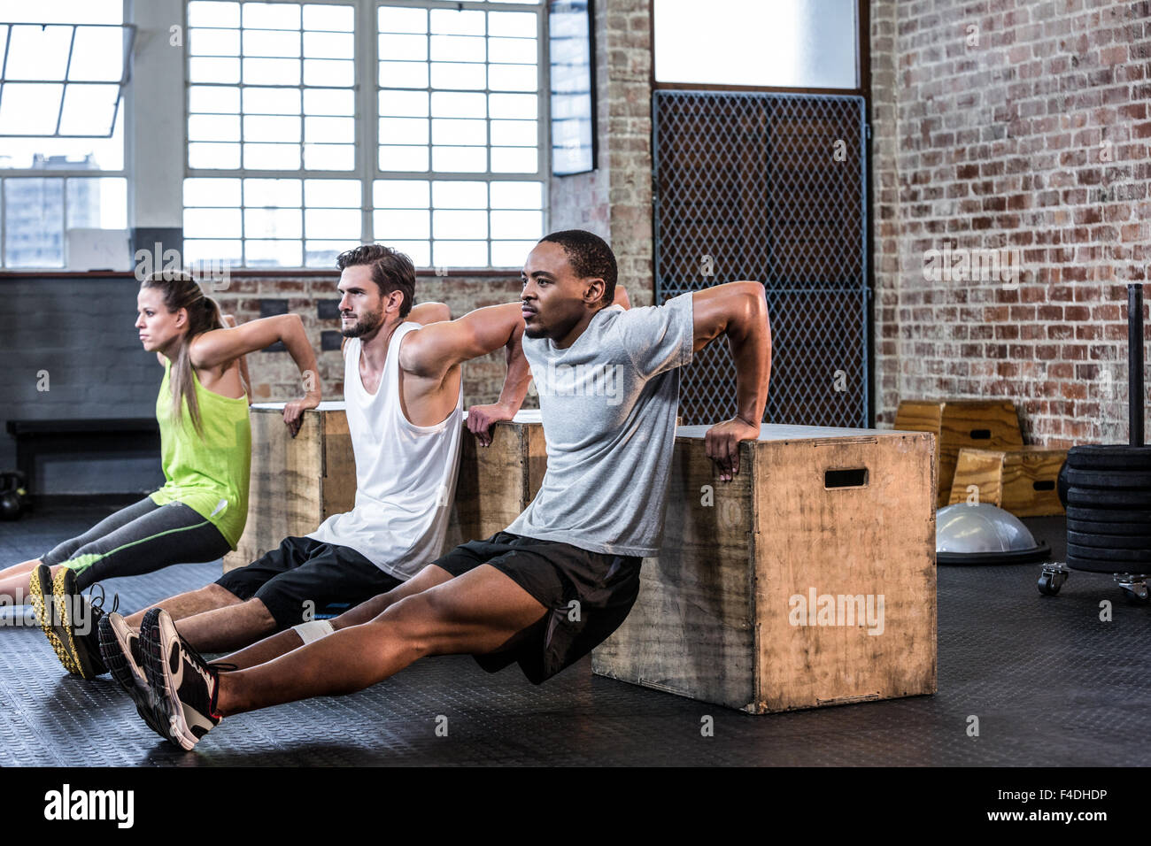 Fit people doing reverse push ups Stock Photo - Alamy