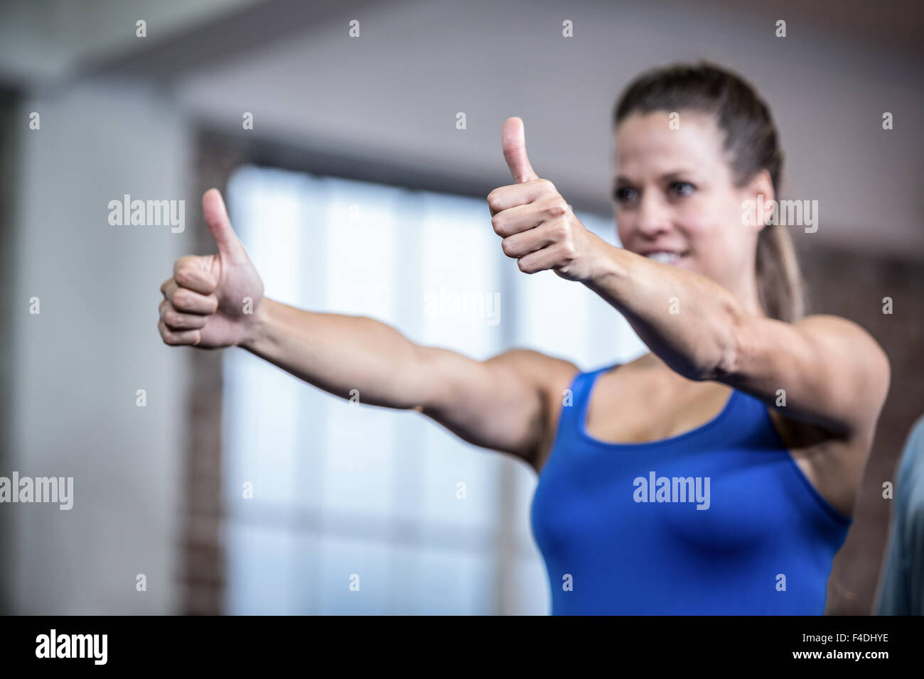 Woman showing thumbs up gym hi-res stock photography and images - Alamy