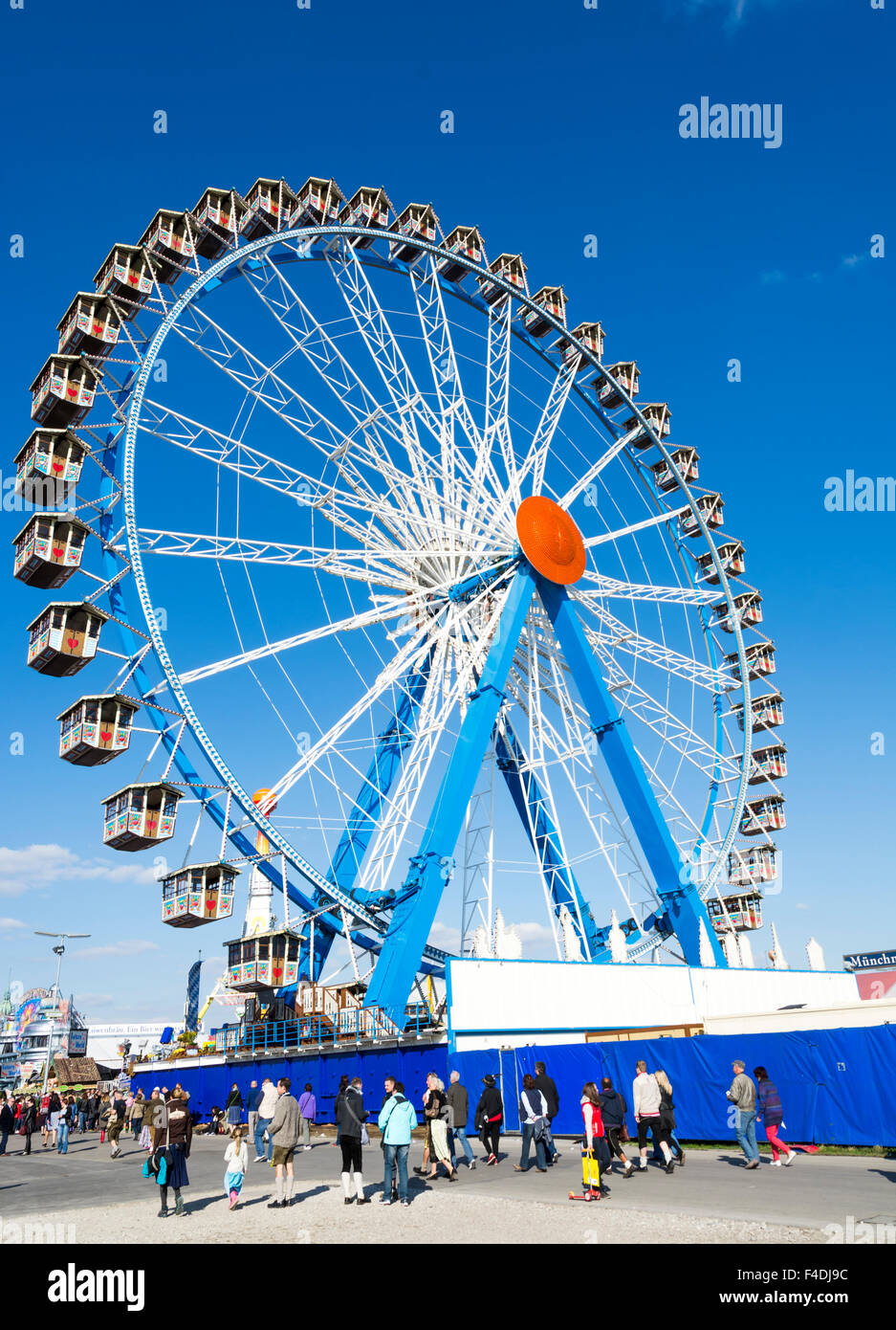 MUNICH, GERMANY - SEPTEMBER 30: People in front of a ferris wheel on ...
