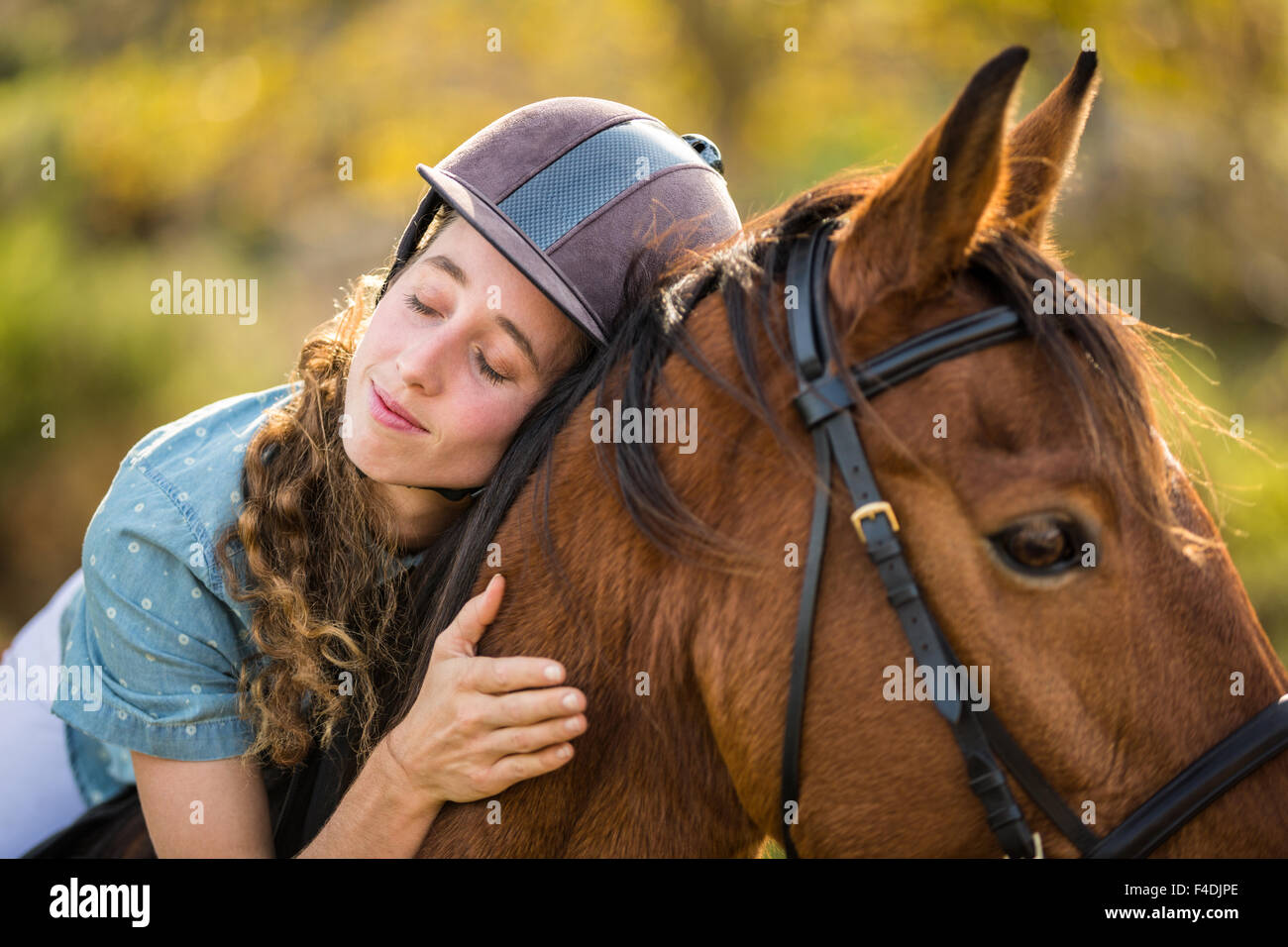 Happy woman riding her horse Stock Photo - Alamy