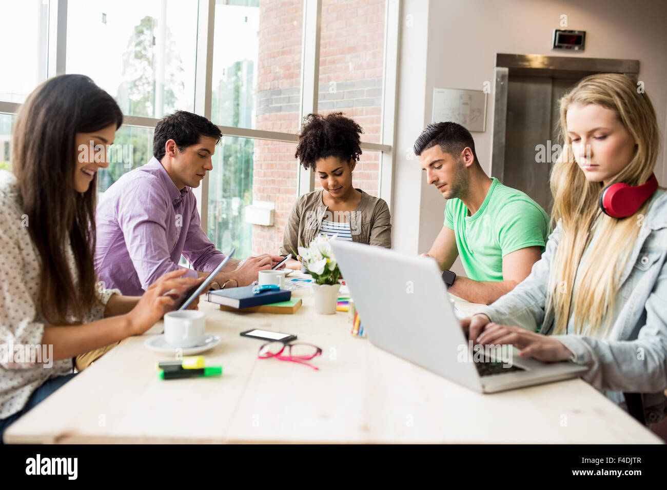 Student using laptop working on assignment Stock Photo - Alamy