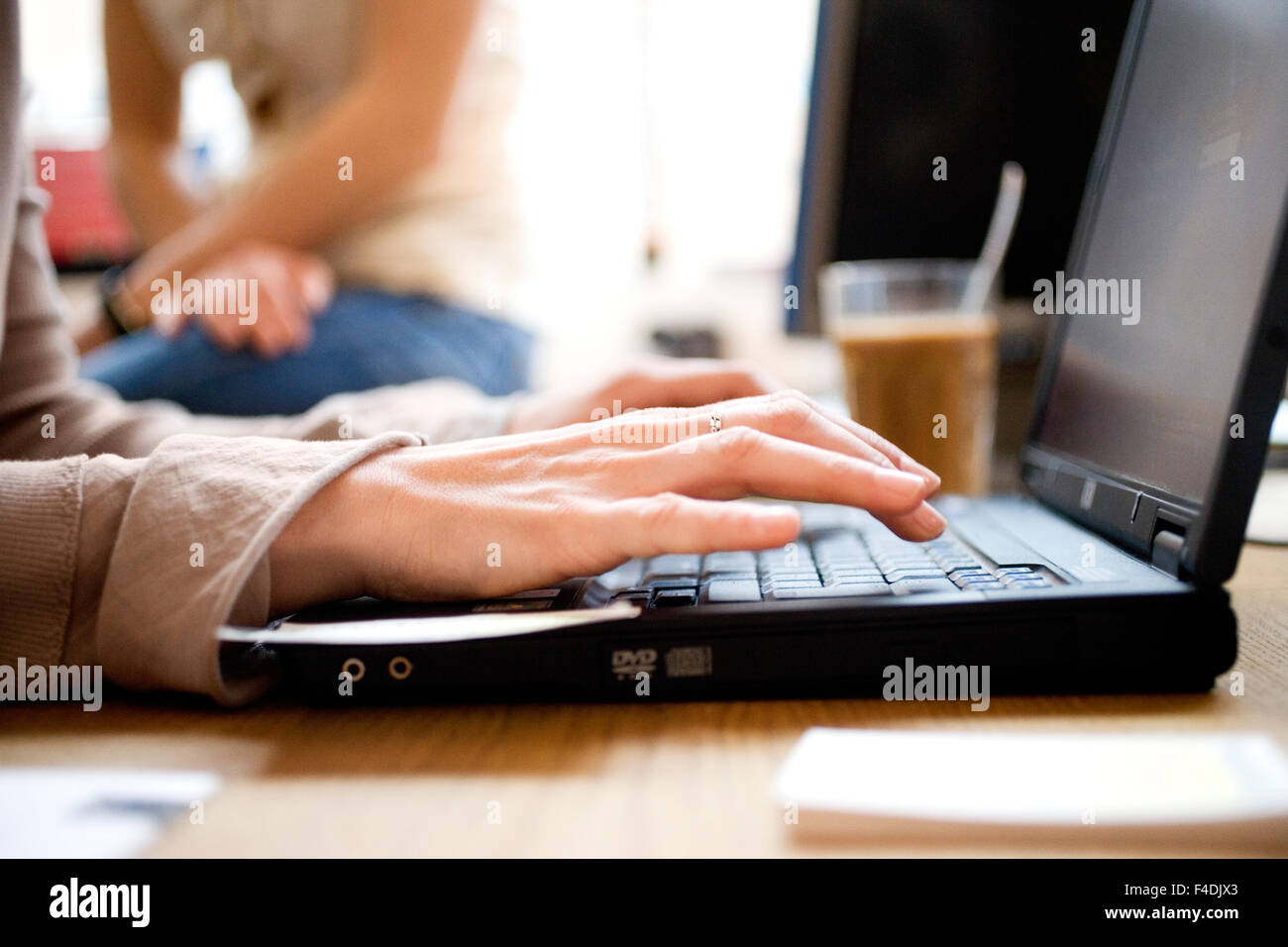 Hands writing on a keyboard Stock Photo - Alamy