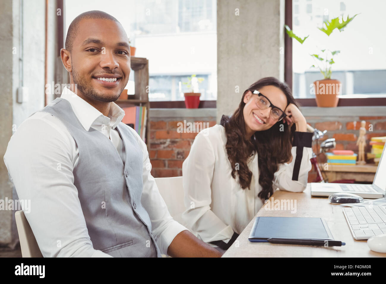 Colleagues relaxing at office Stock Photo - Alamy