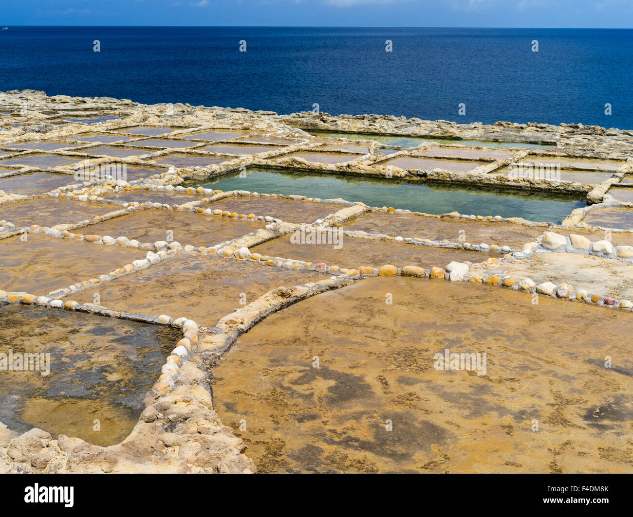 The island of Gozo in the Maltese archipelago. Traditional salt ...