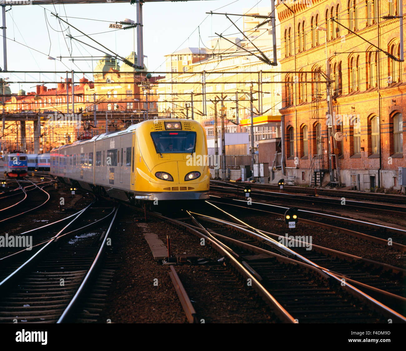 Train travelling through railway tracks Stock Photo - Alamy
