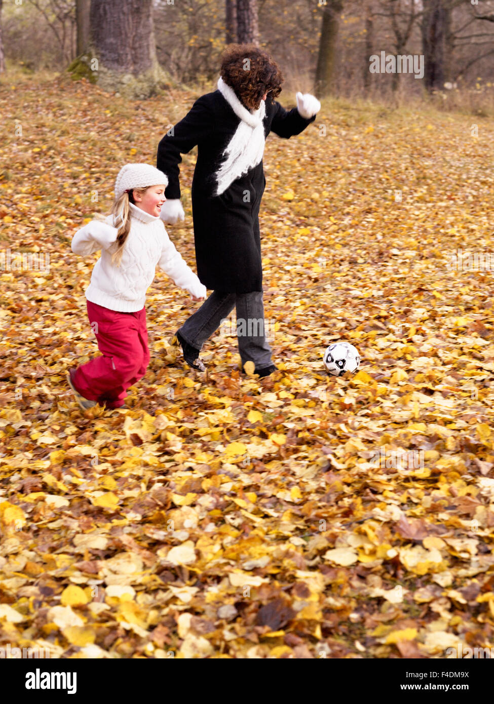 Mother and daughter playing soccer Stock Photo - Alamy