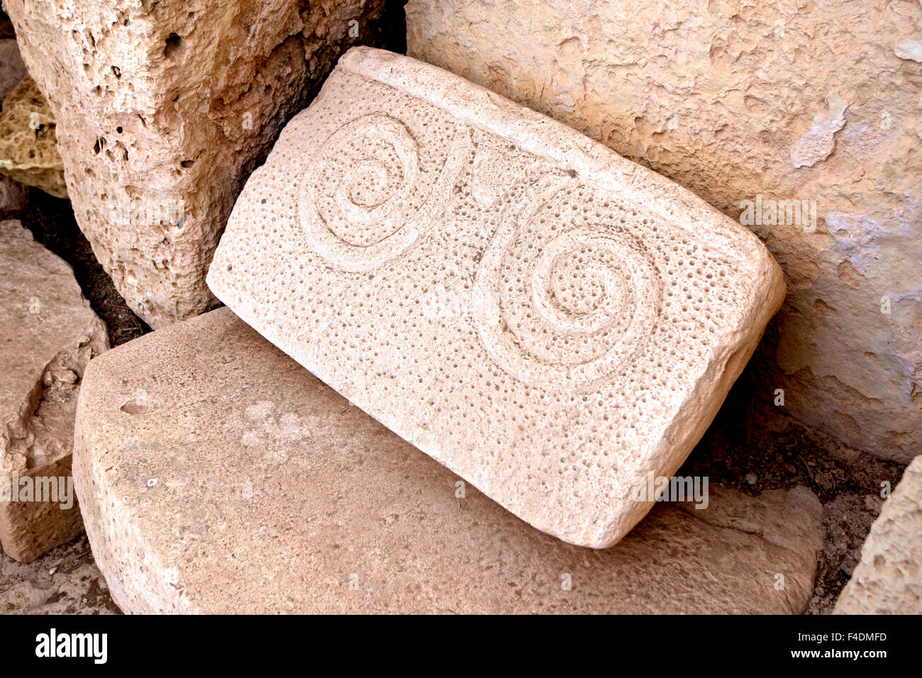 A scroll carving on a stone at Hagar Qim temple, Malta Stock Photo - Alamy