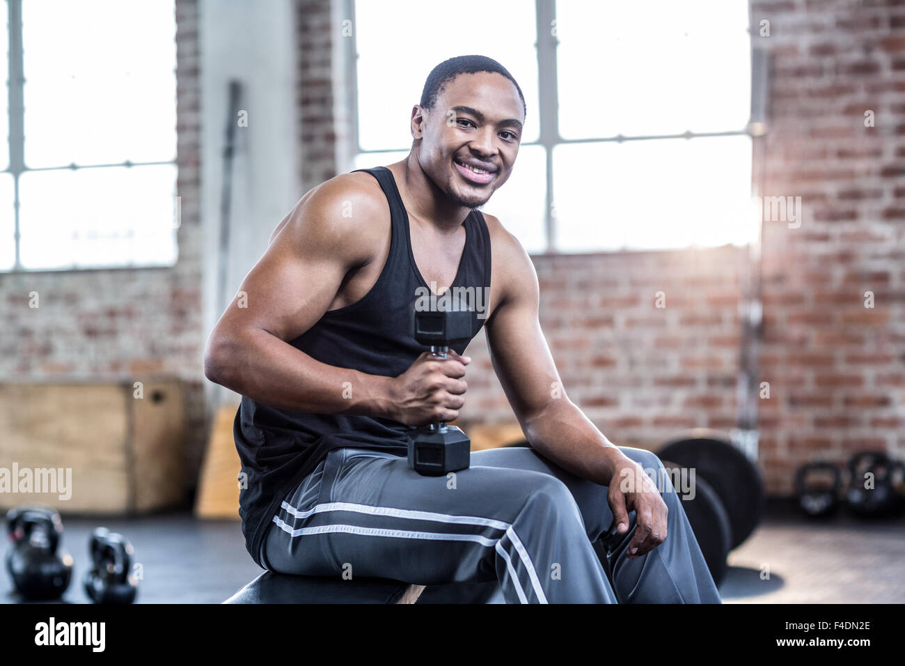 Young man doing strength exercises hi-res stock photography and images ...