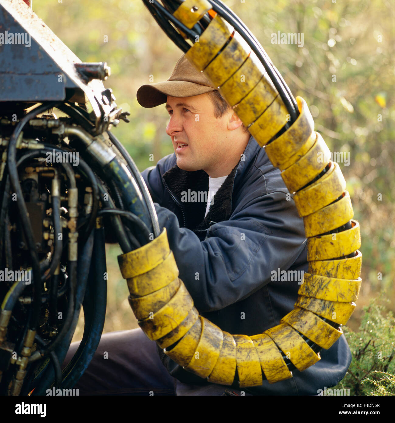 Man repairing machine Stock Photo - Alamy