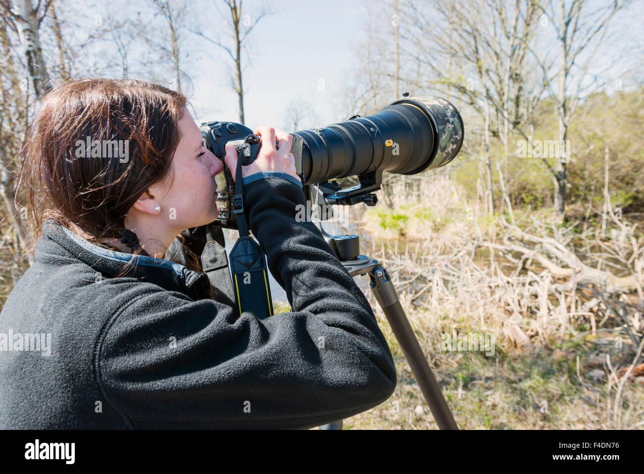 Young woman with big camera Stock Photo - Alamy