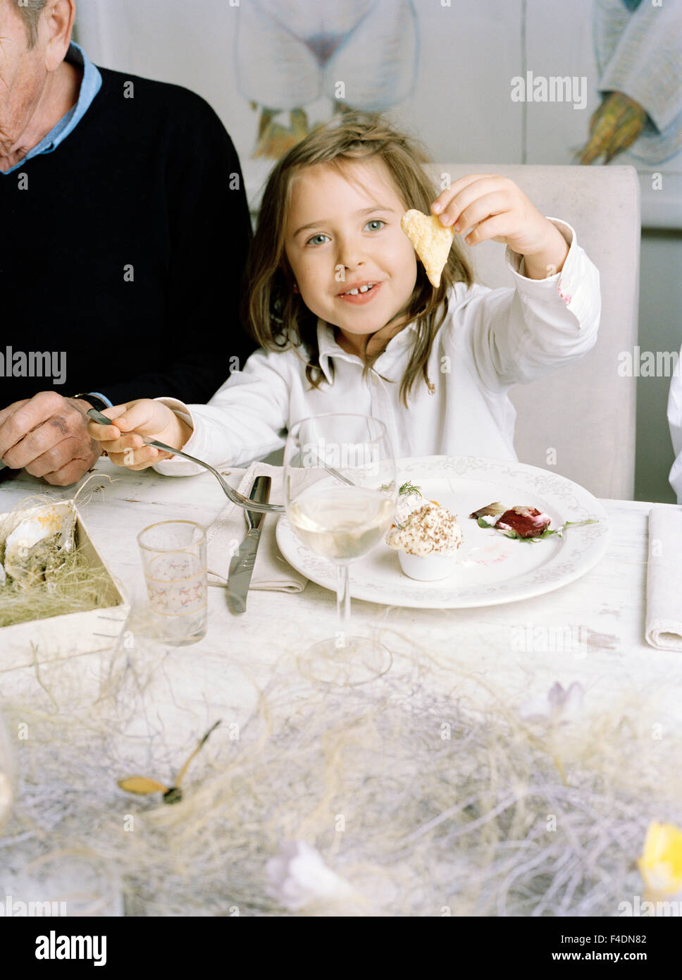 Girl at the dinner table Stock Photo - Alamy