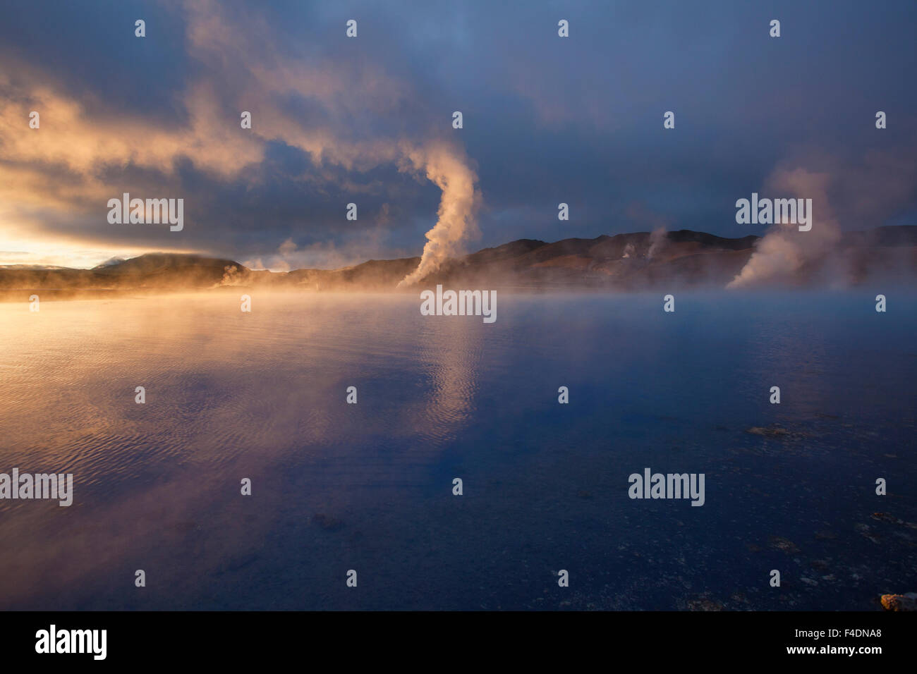 Sunset light on the streaming geothermal vents at Bjarnarflag, Myvatn ...