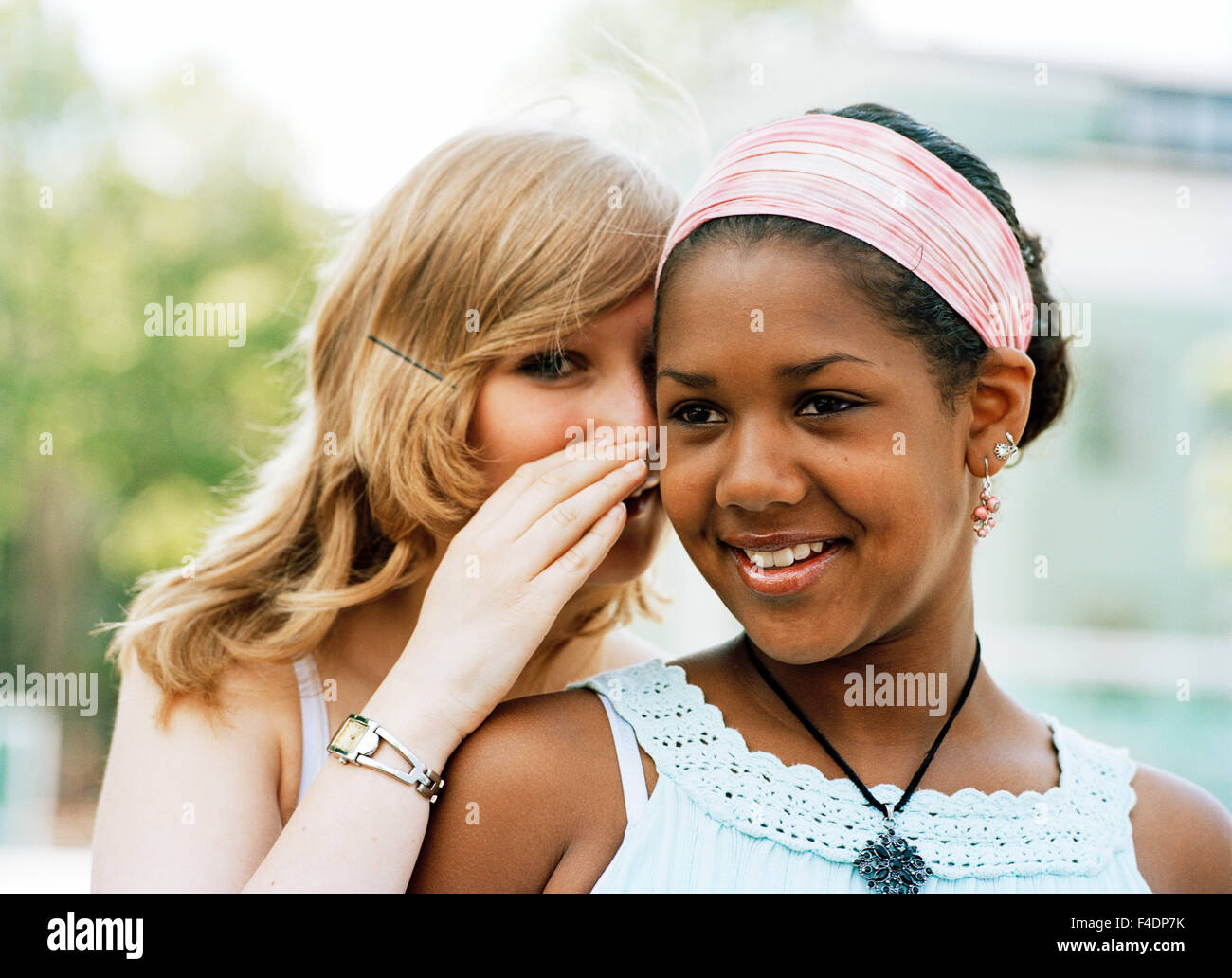Two Girls Whispering High Resolution Stock Photography and Images - Alamy