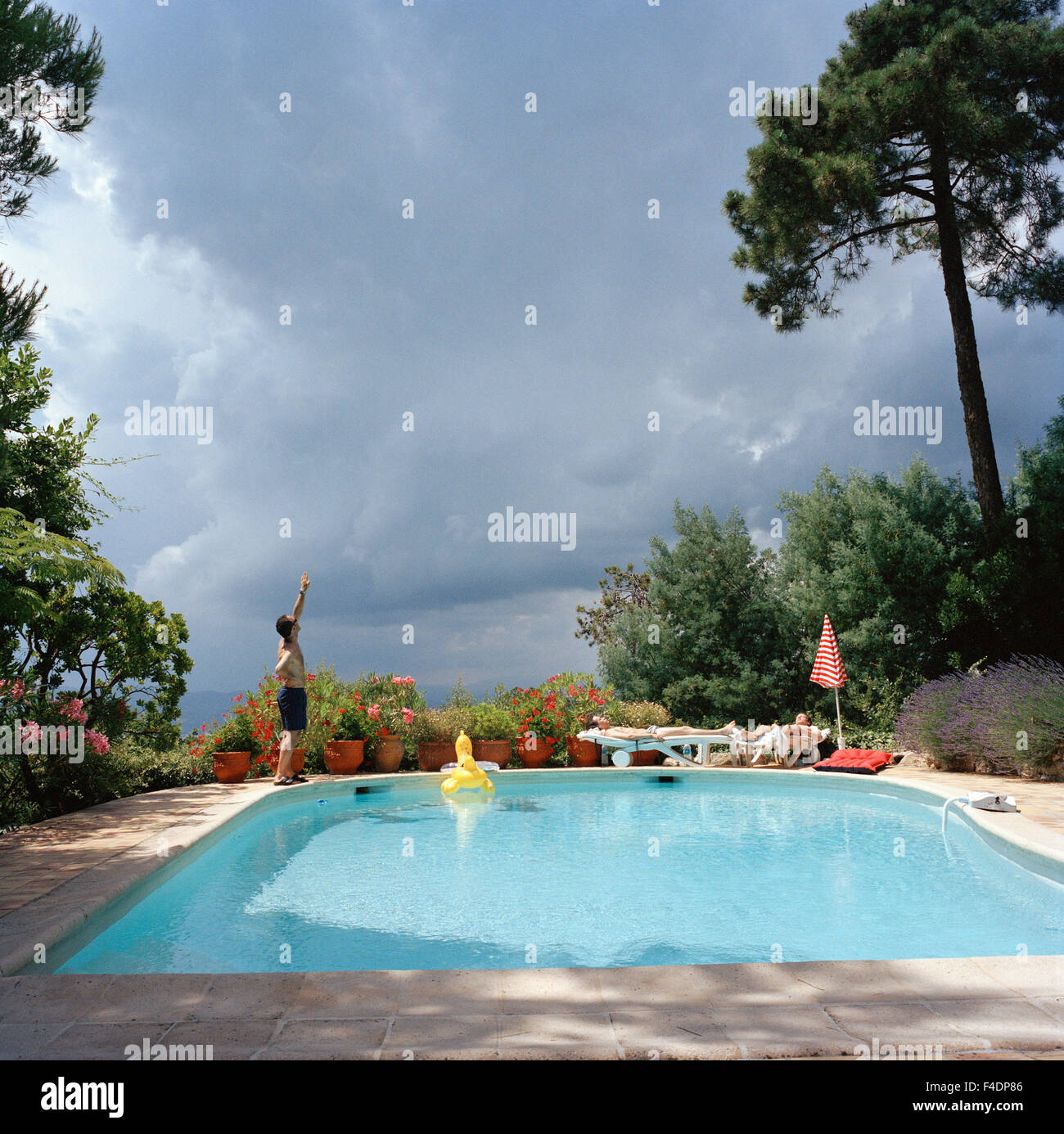 Dark clouds over a swimming-pool Stock Photo - Alamy
