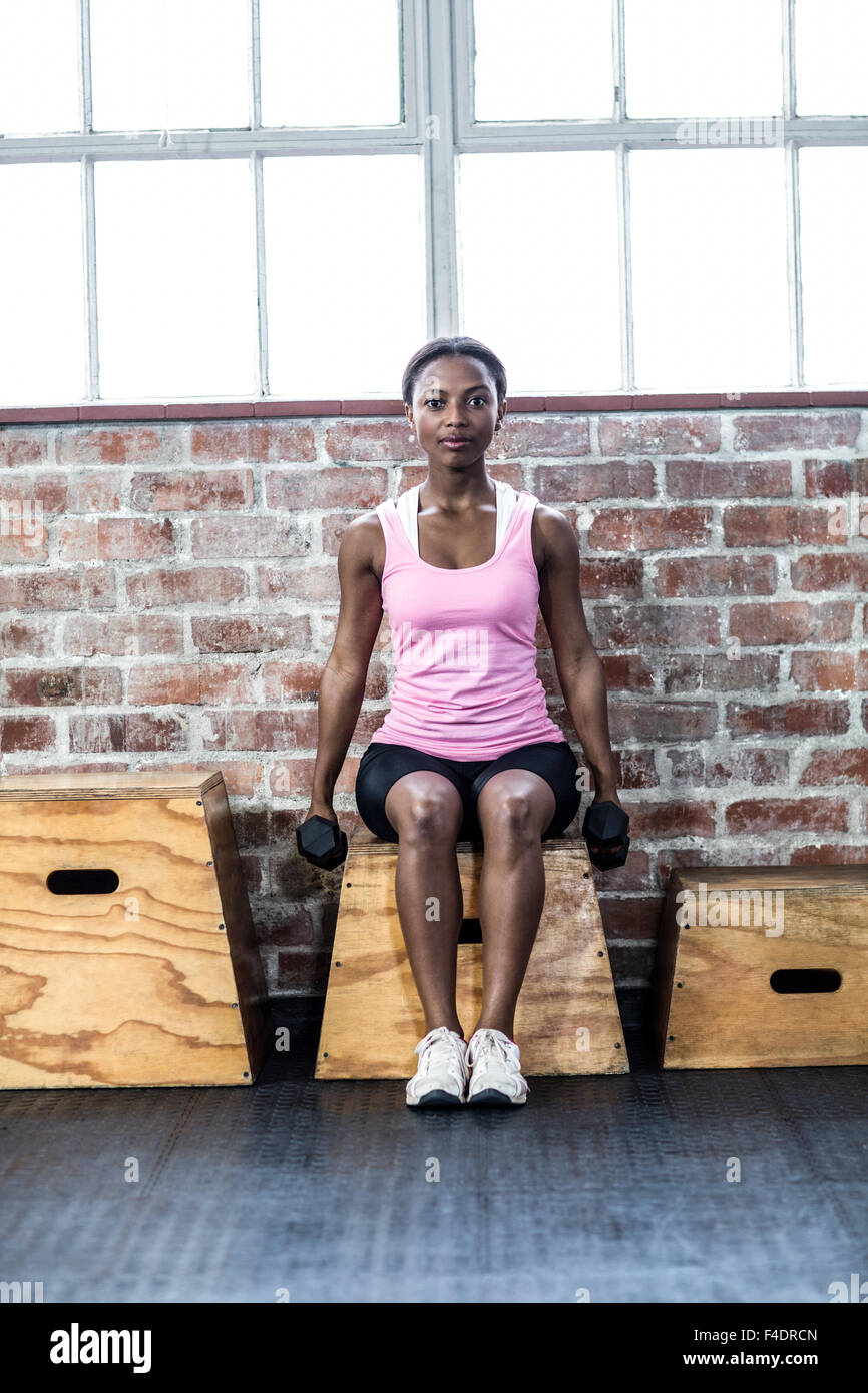 Fit woman doing some exercise sit on a box Stock Photo - Alamy