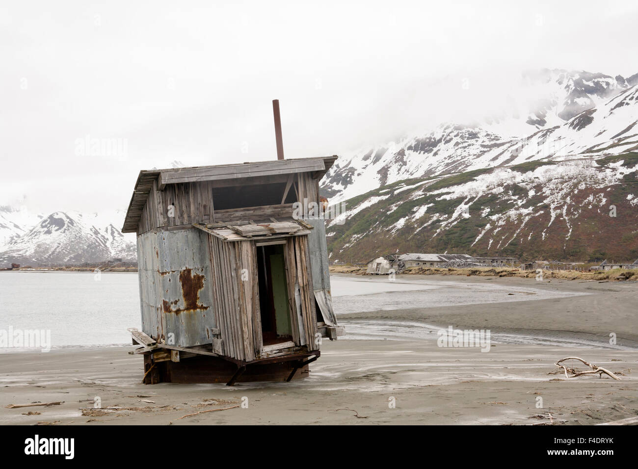 Russia, Kamchatka, Lavrova Bay, Old shack on beach near abandoned mink ...
