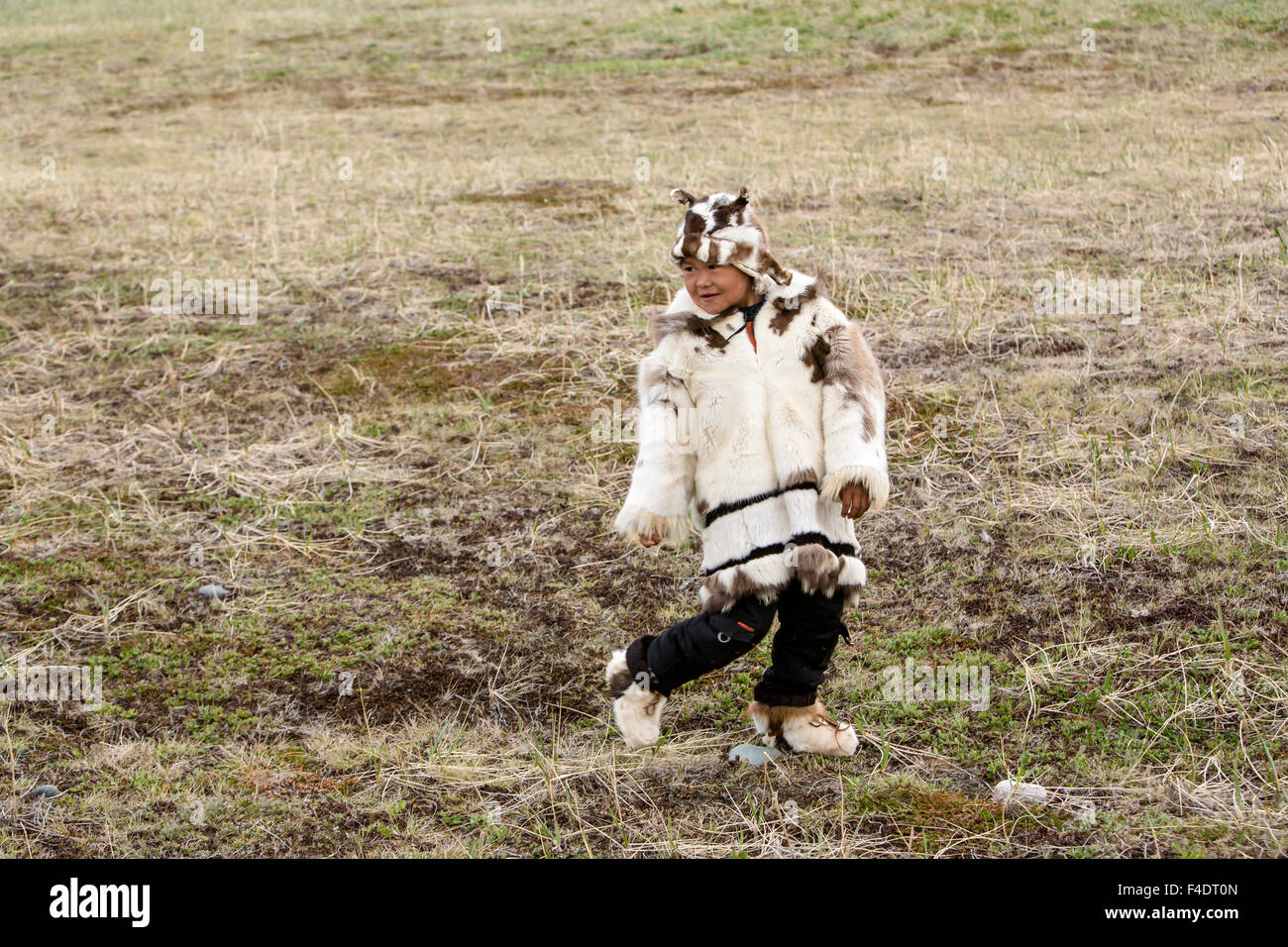 Russia, Chukotka, Yanrakynnot, Chukchi boy in fur coat Stock Photo - Alamy