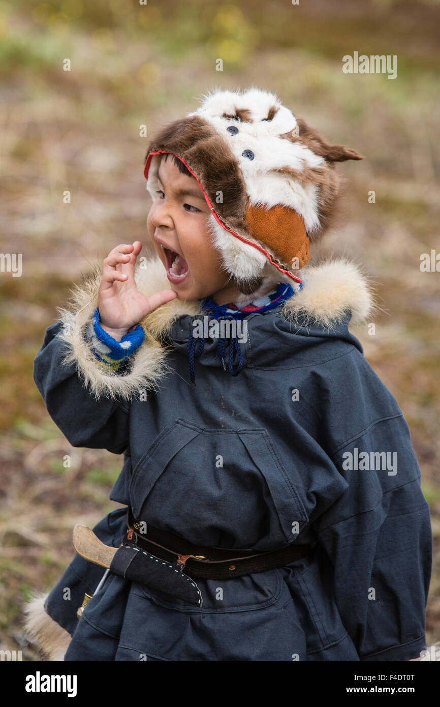 Russia, Chukotka, Yanrakynnot, Chukchi boy wearing fur hat Stock Photo ...
