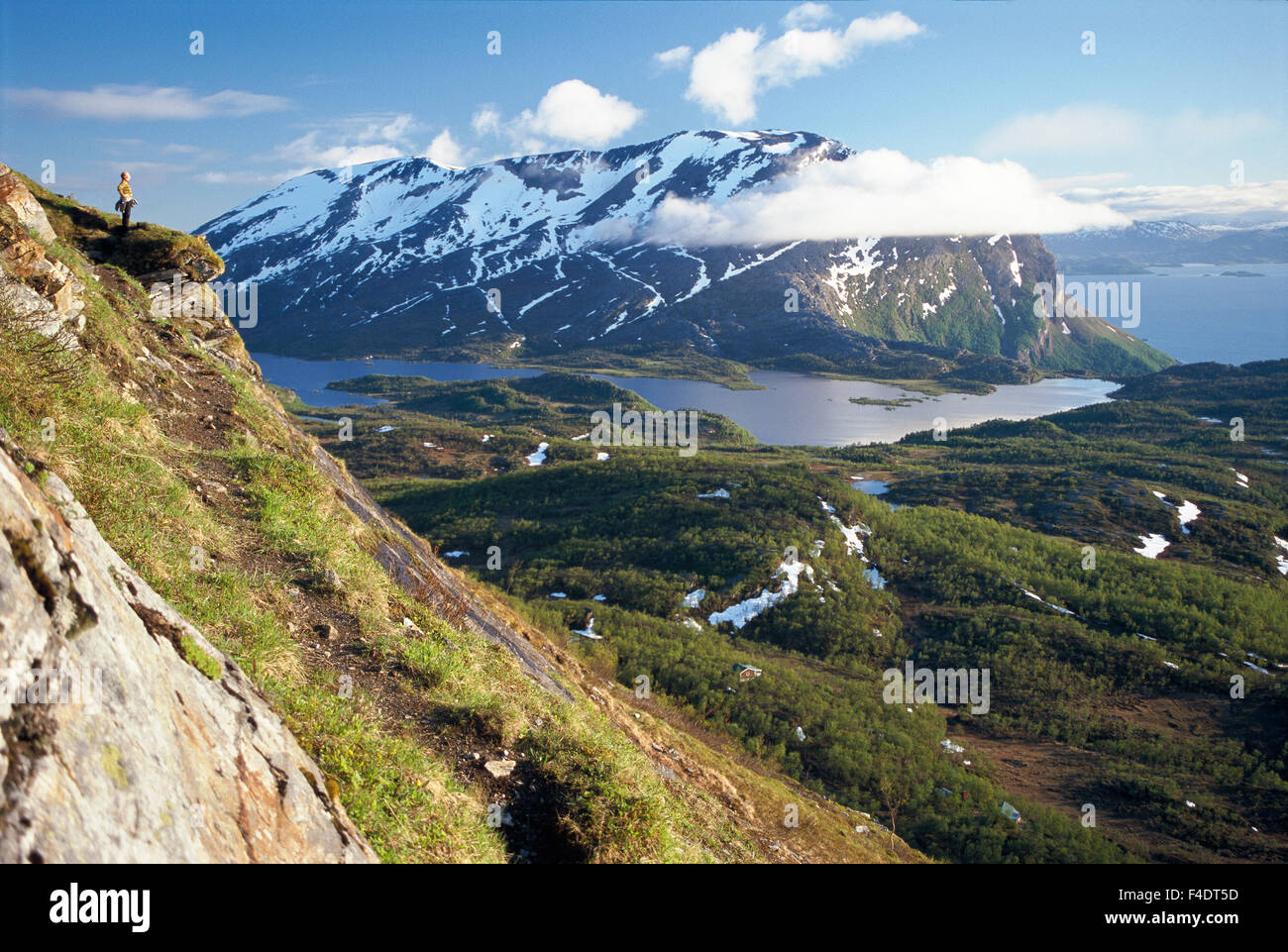 Person looking out over mountains Stock Photo - Alamy