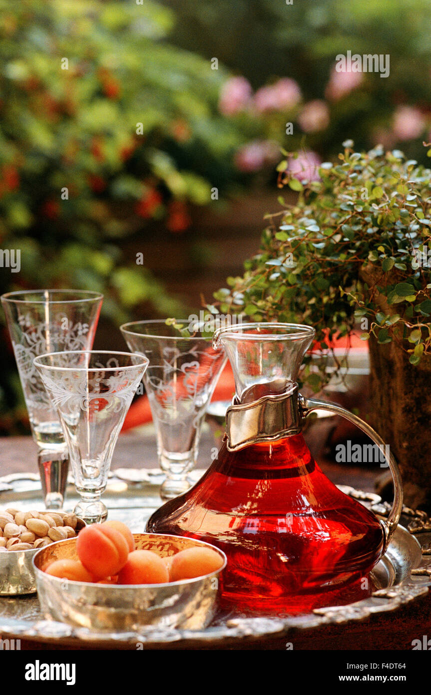 Carafe with wine and snack on a tray Stock Photo - Alamy