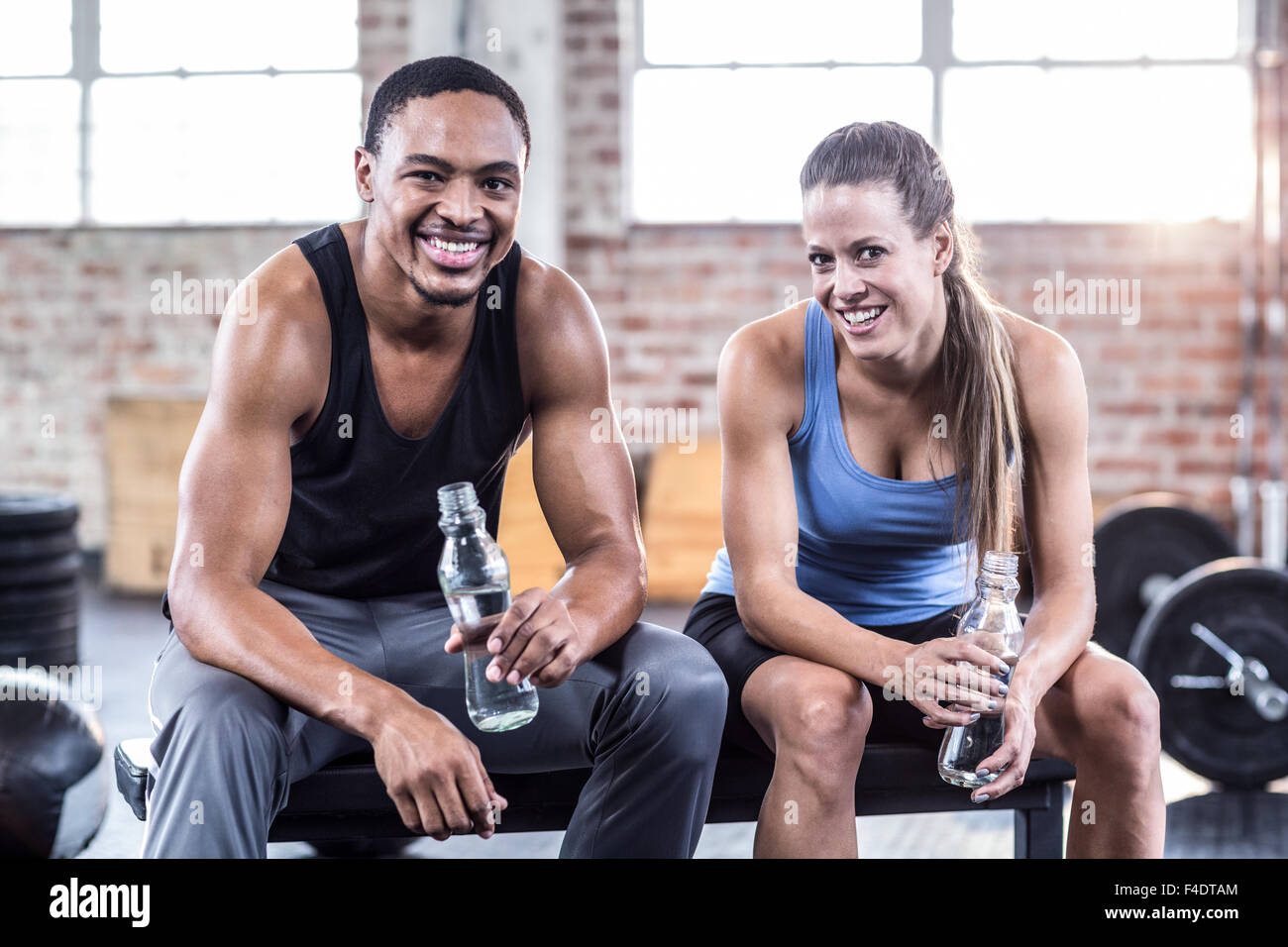 Fit couple drinking water together Stock Photo - Alamy