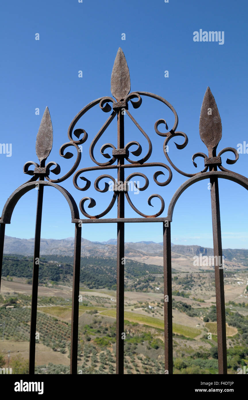 Europe, Spain, Andalusia, Malaga Province, Ronda. Gate overlooking ...