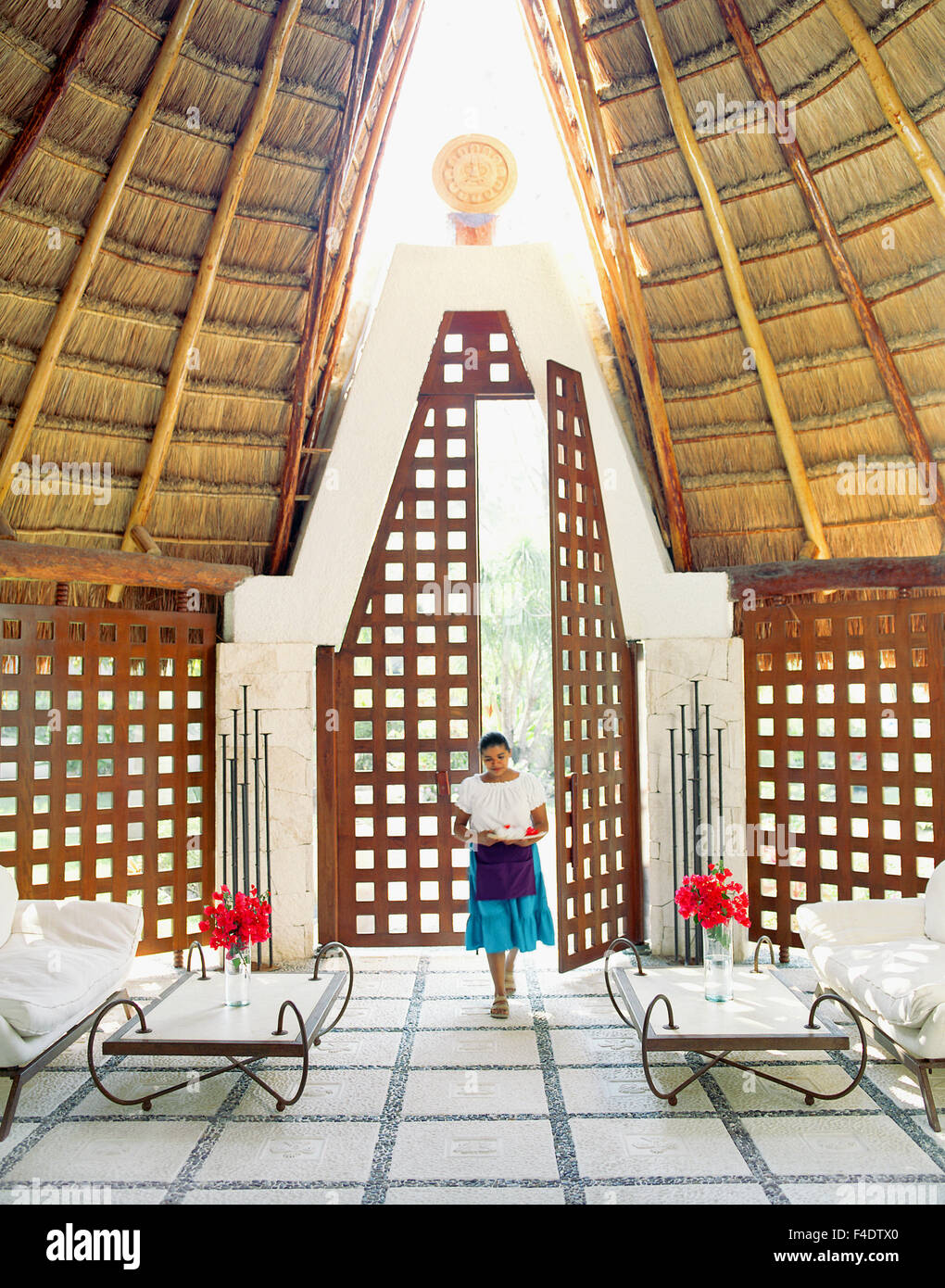 A Mexican staff member walks through the main spa entrance at Maroma ...