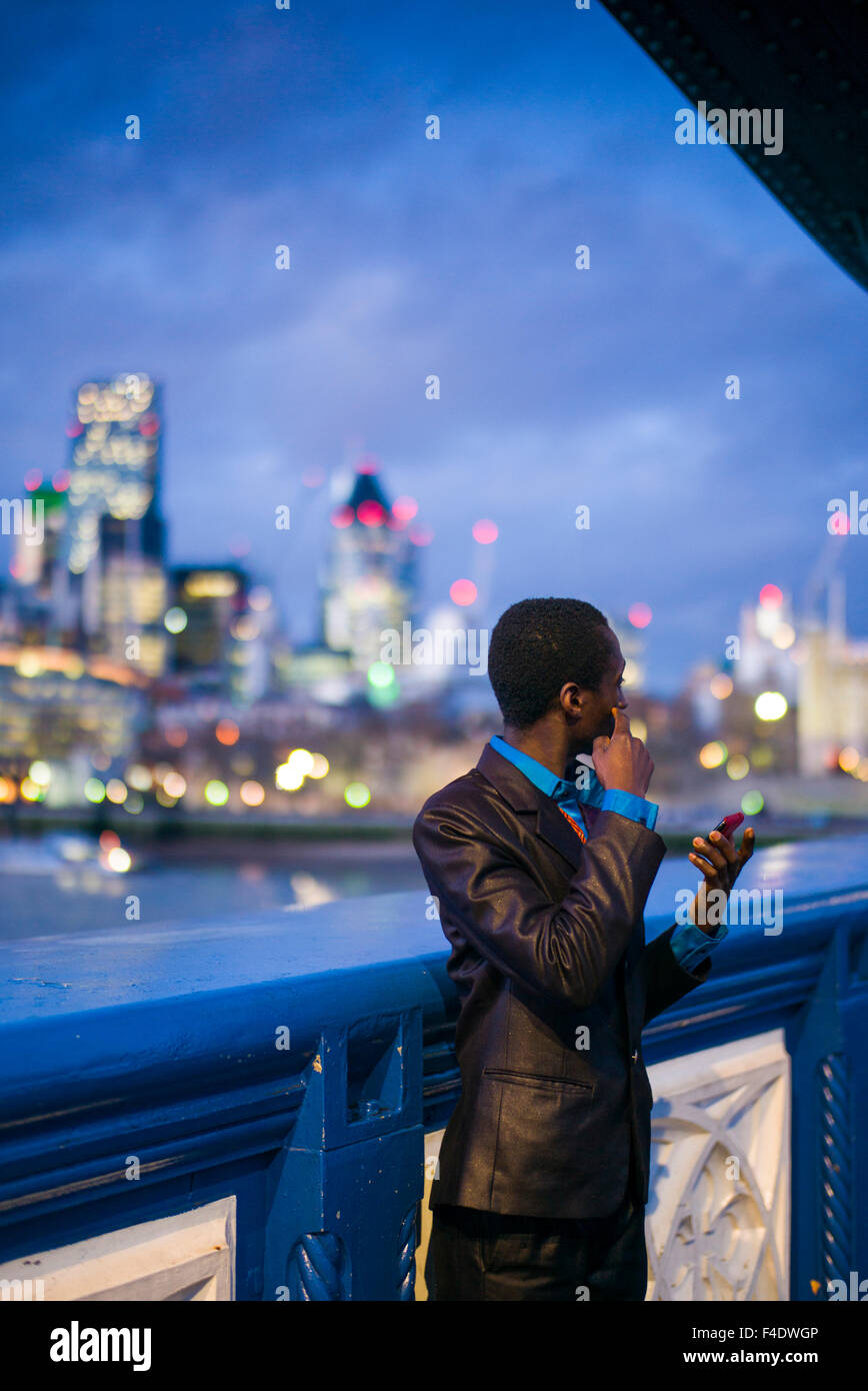 England, London, man on Tower Bridge, dusk Stock Photo - Alamy