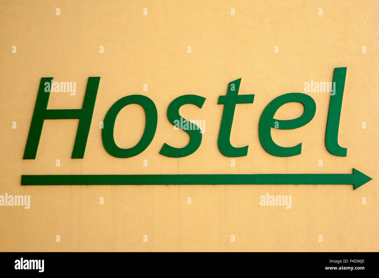 Hostel Sign on a Yellow Background Stock Photo - Alamy