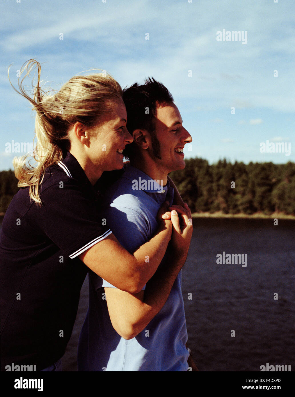 Young smiling Scandinavian couple embracing Stock Photo - Alamy
