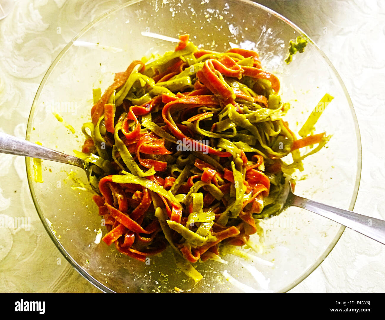 Italian noodles green and red, flavored with spinach and tomato served ...