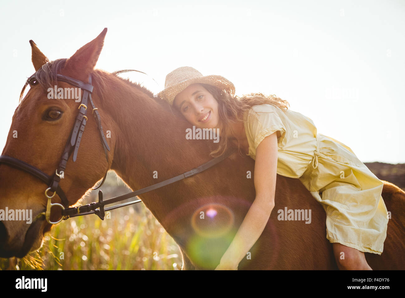 Young happy woman riding her horse Stock Photo - Alamy
