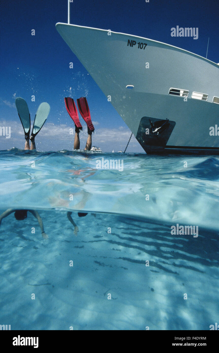 People wearing flippers diving into water (Large format sizes available ...
